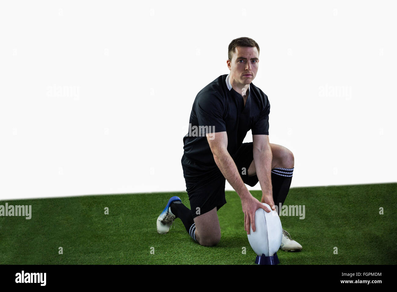 Rugby player ready to make a drop kick Stock Photo - Alamy