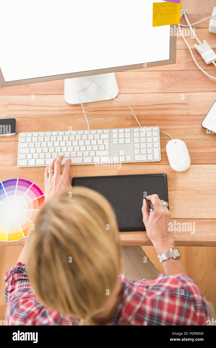 Casual designer working with digitizer and computer Stock Photo - Alamy