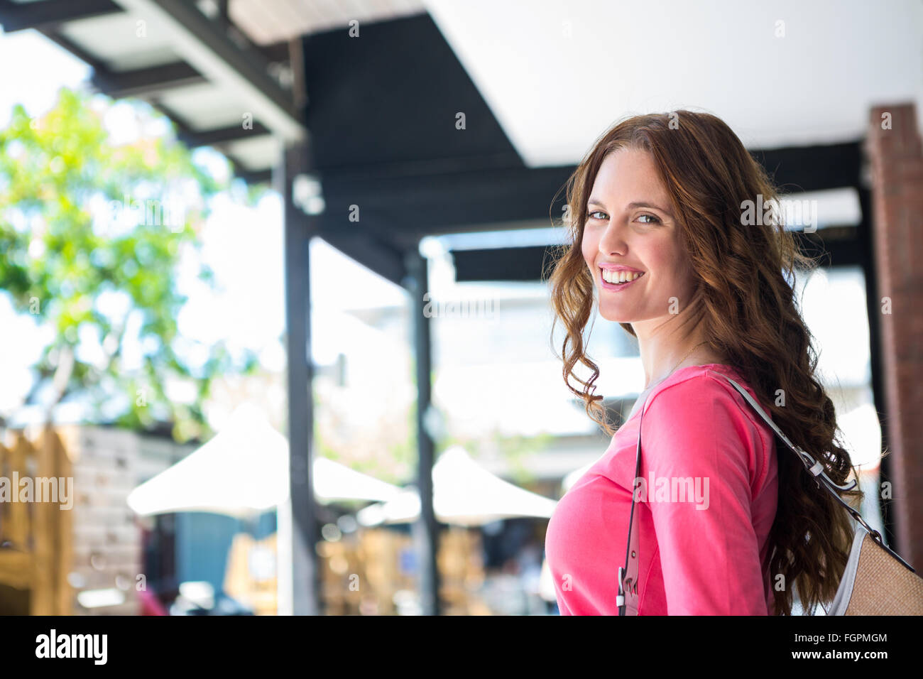 Pretty woman smiling at the mall Stock Photo - Alamy
