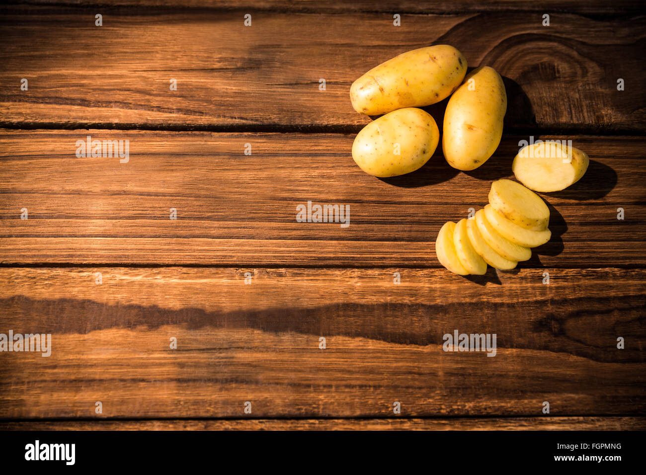 Potato slices on a table Stock Photo - Alamy