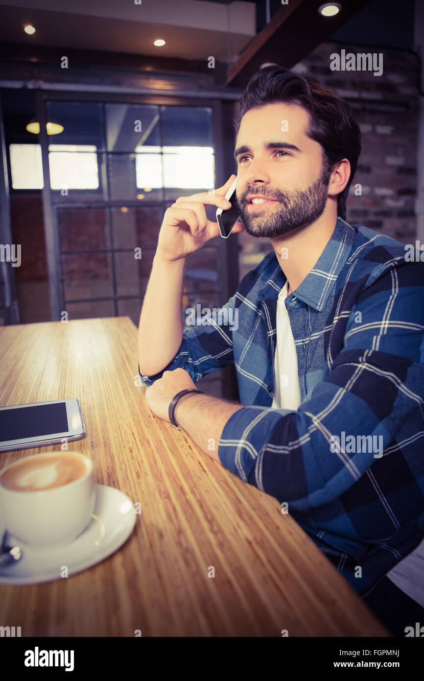 Young student calling a client Stock Photo - Alamy