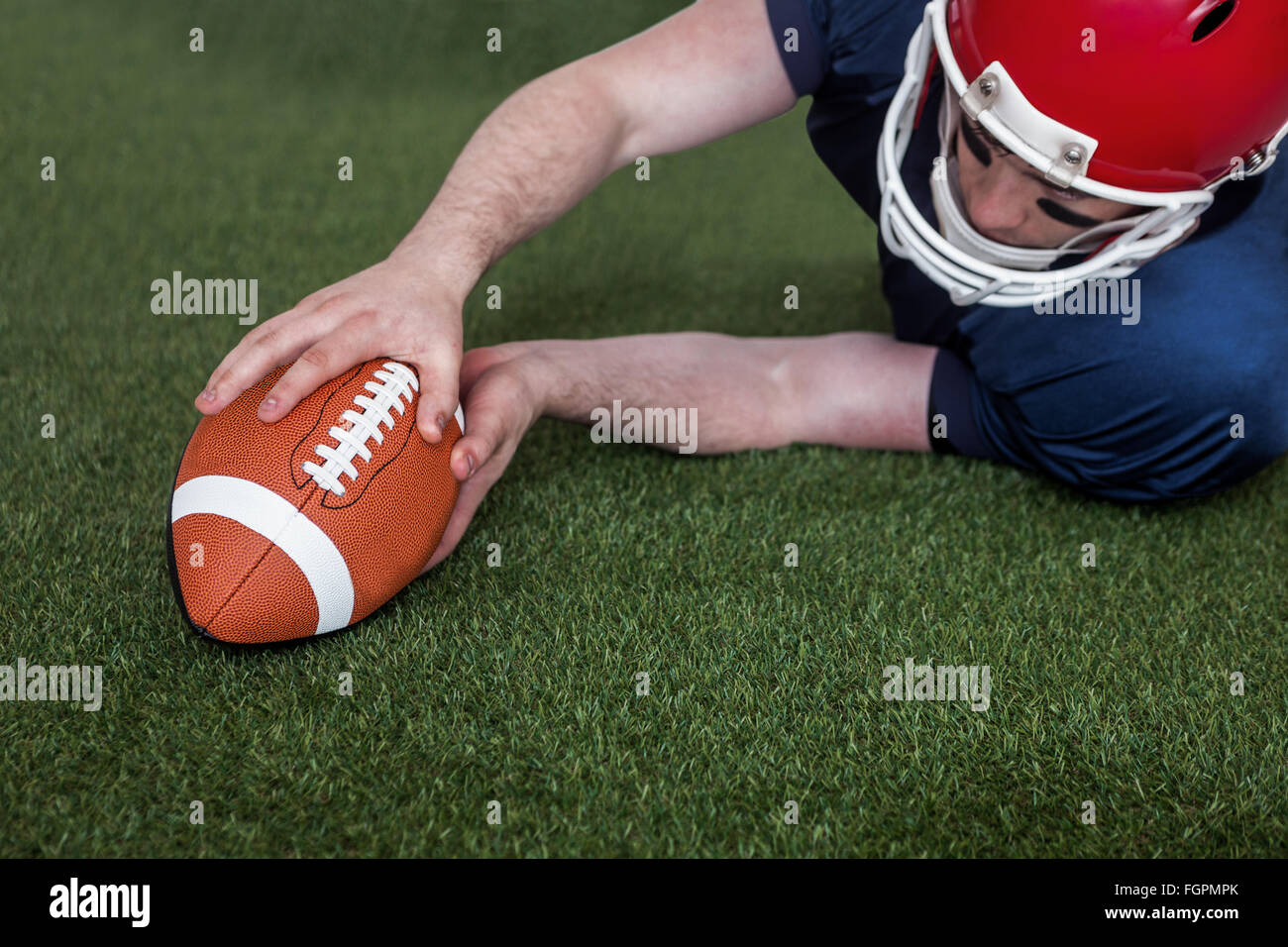 American football player scoring a touchdown Stock Photo - Alamy