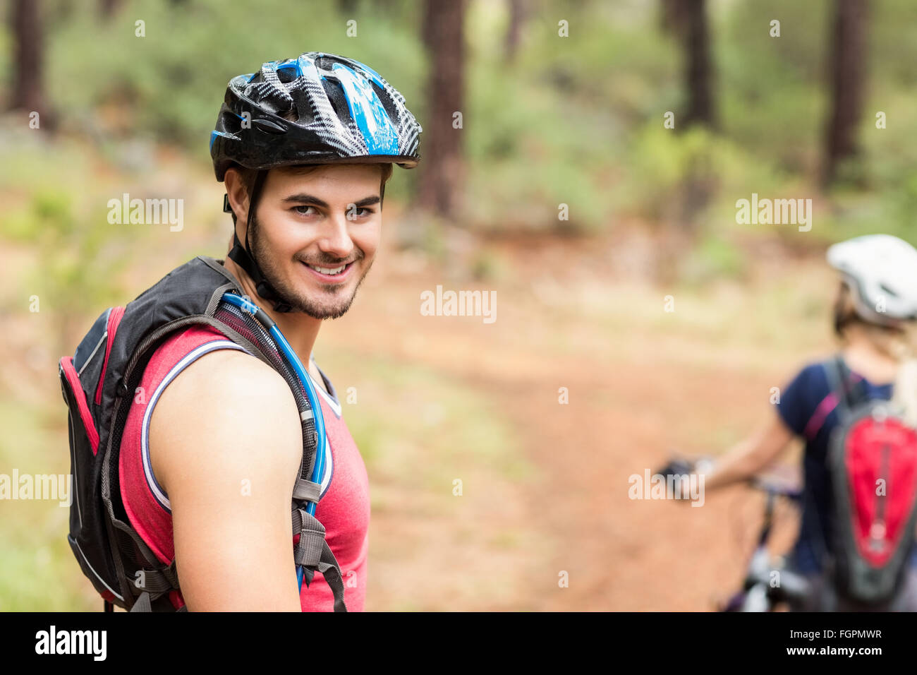Handsome biker looking at the camera Stock Photo - Alamy