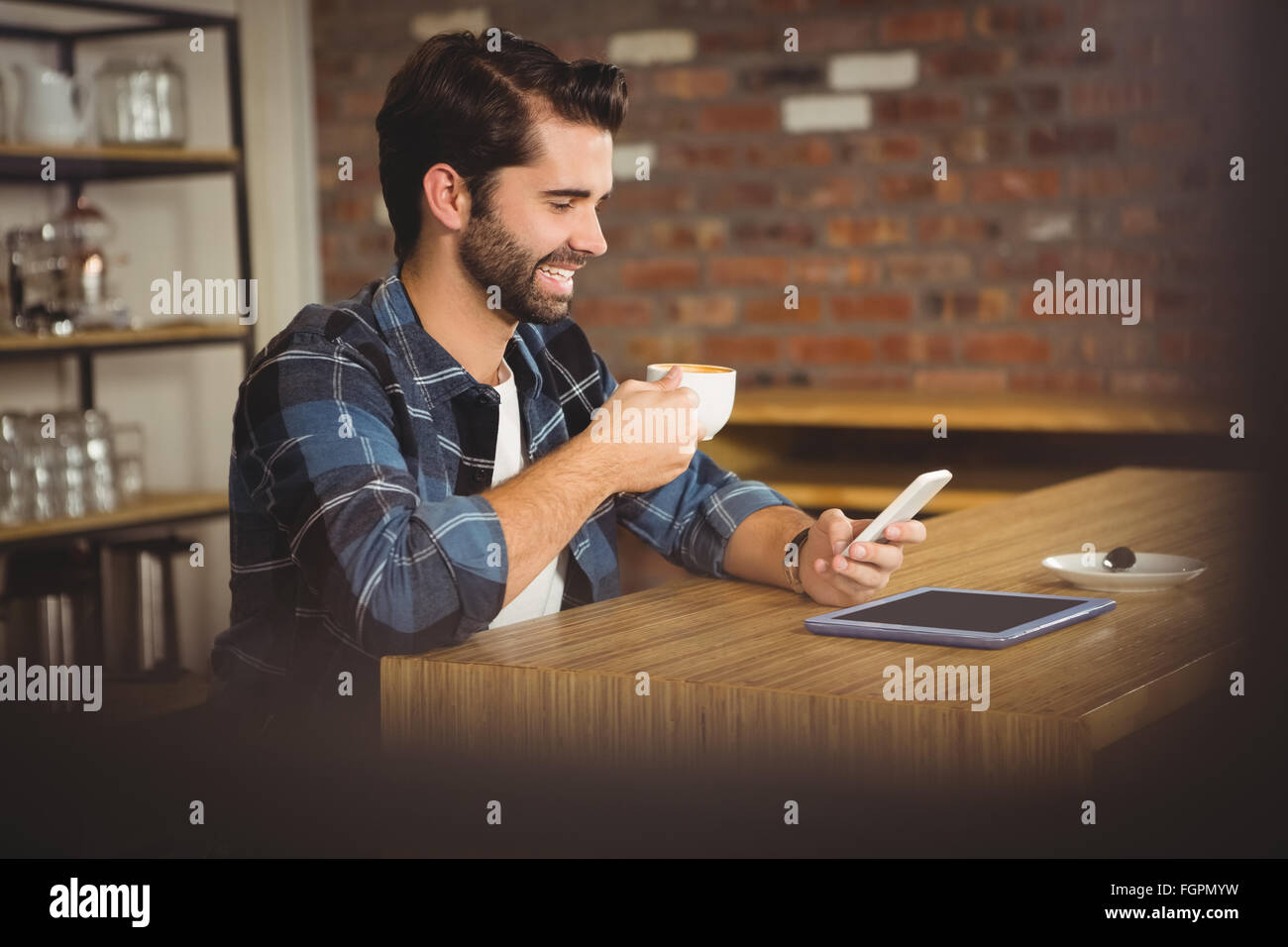 Man using tab at coffee shop hi-res stock photography and images - Alamy