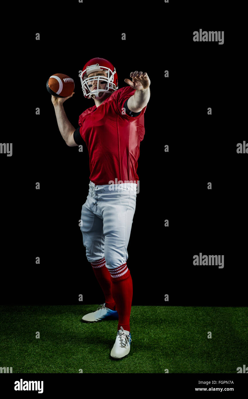 American football player throwing football Stock Photo - Alamy