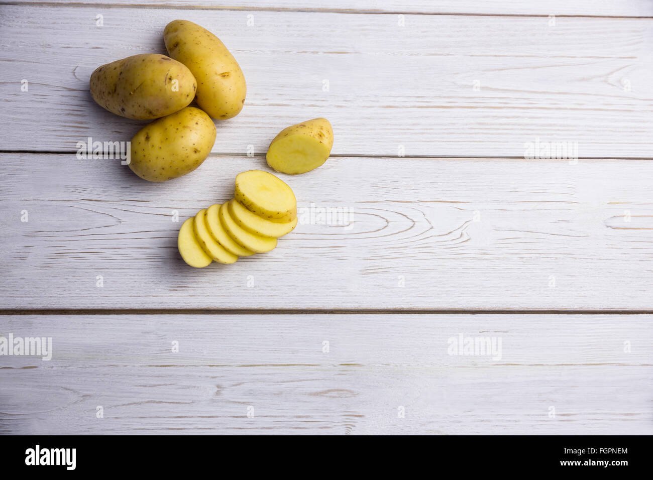 Potato slices on a table Stock Photo - Alamy