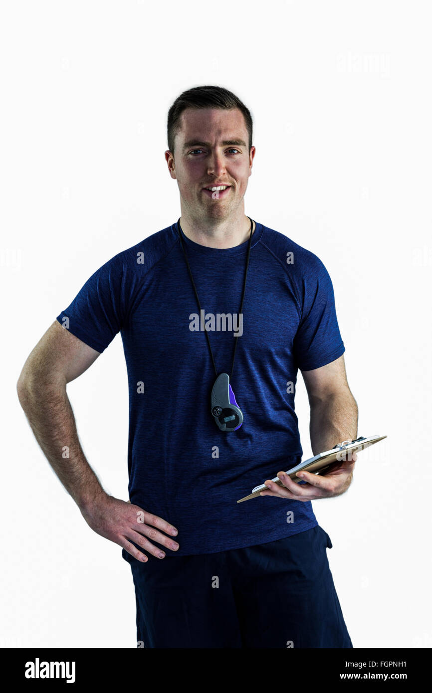 Smiling trainer holding a clipboard Stock Photo - Alamy
