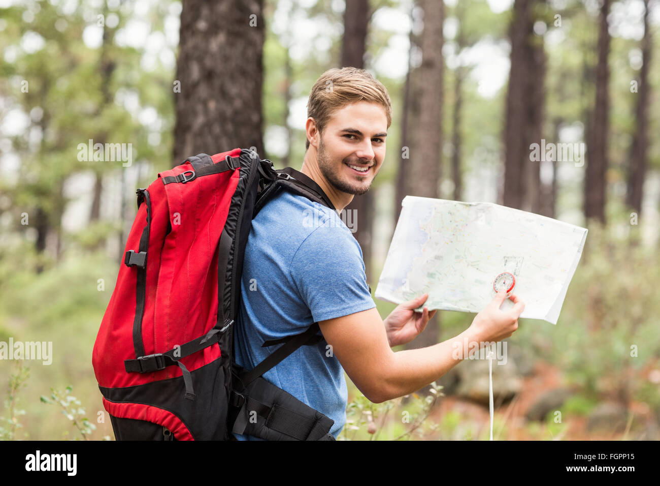 Young handsome hiker using map Stock Photo - Alamy