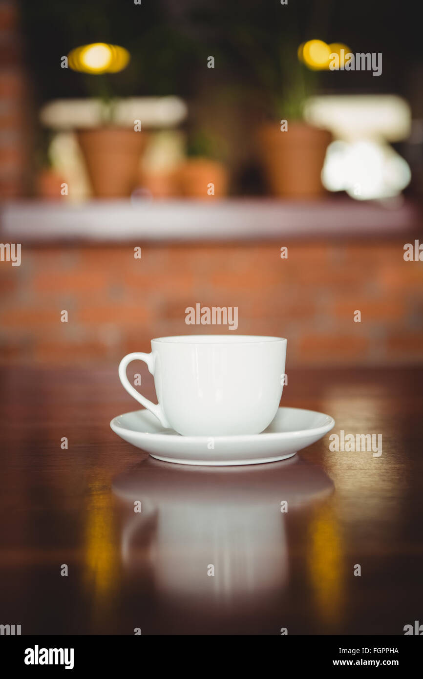 Cup and saucer on the counter Stock Photo - Alamy