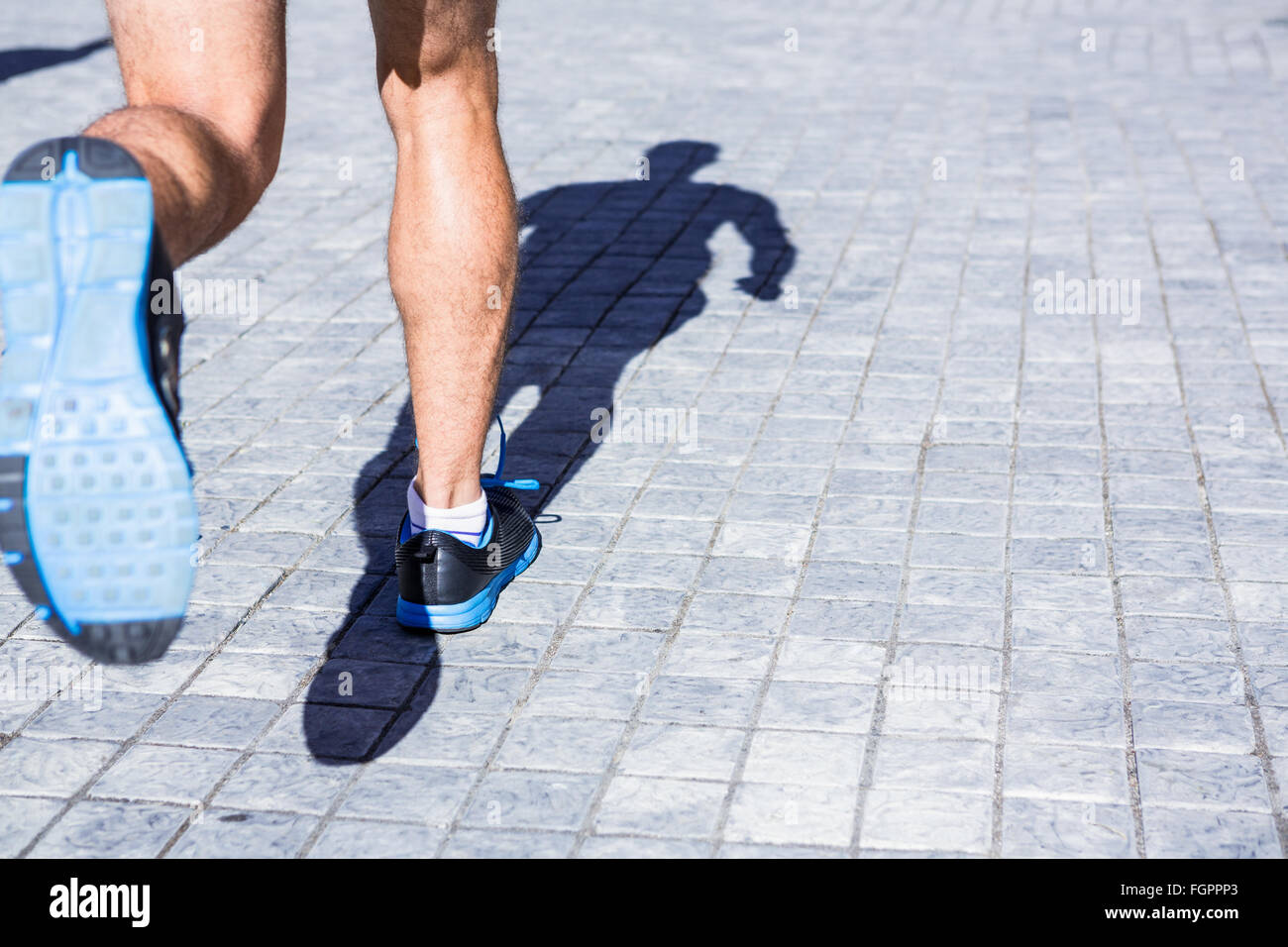 Close up view of athletes legs running Stock Photo - Alamy