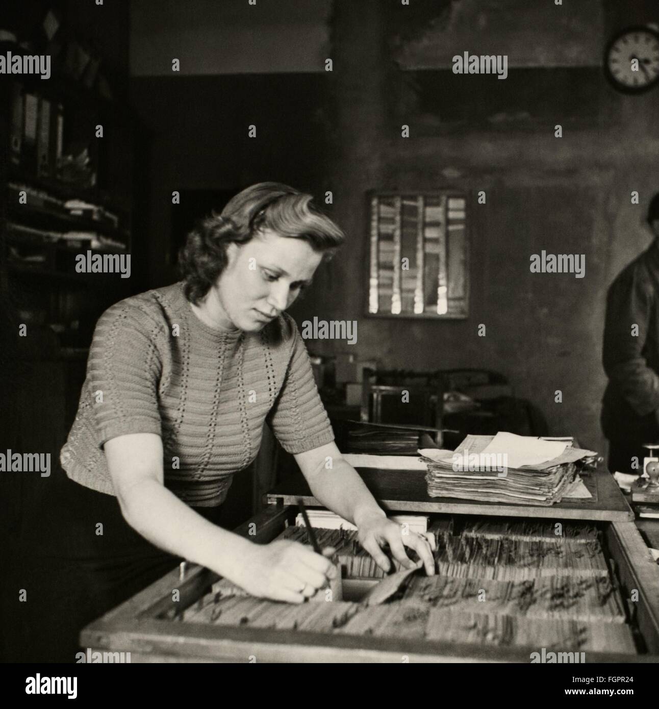 people, professions, office, female clerk working with a card file ...