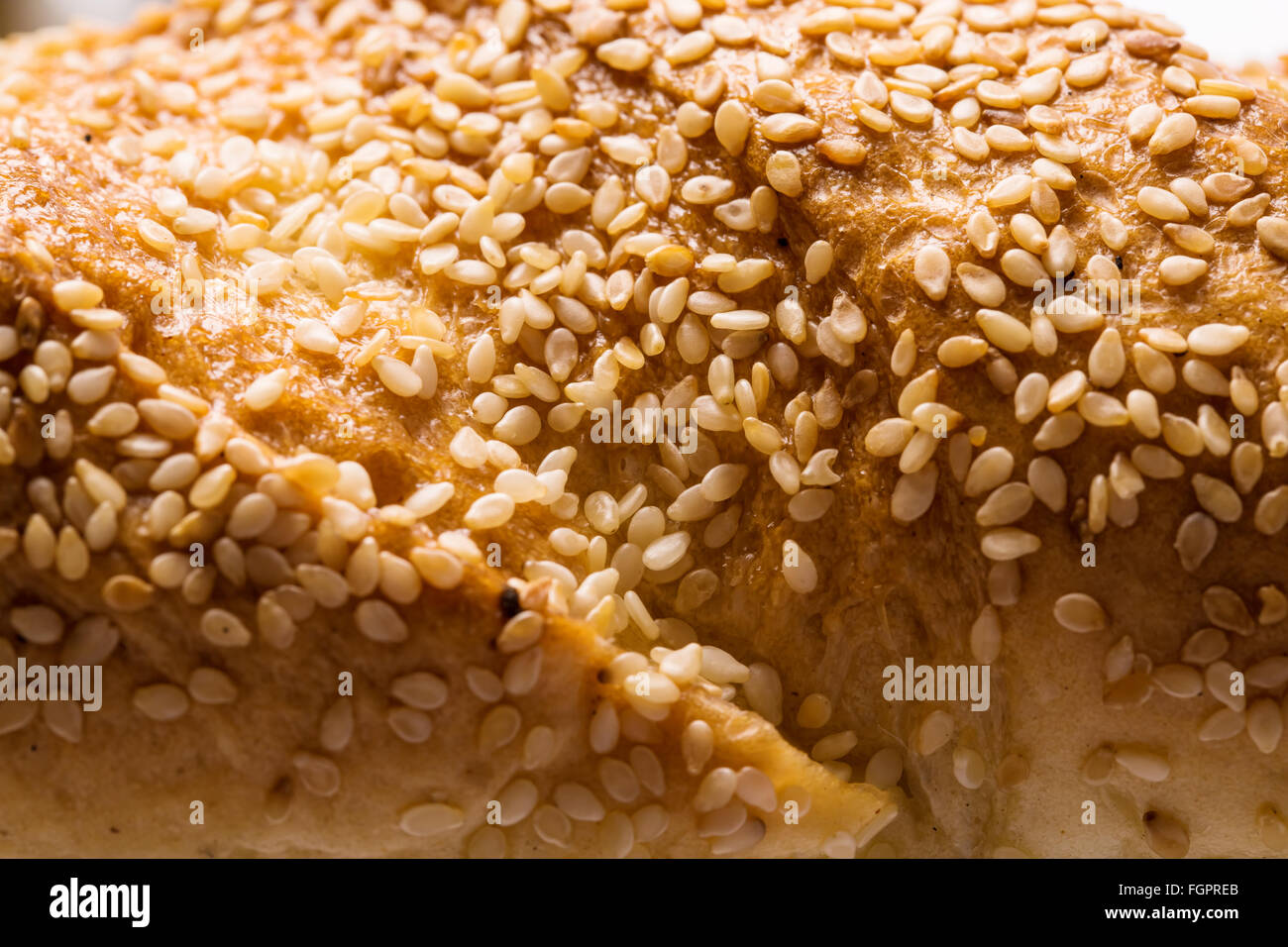 Loaf with sesame seeds background Stock Photo - Alamy