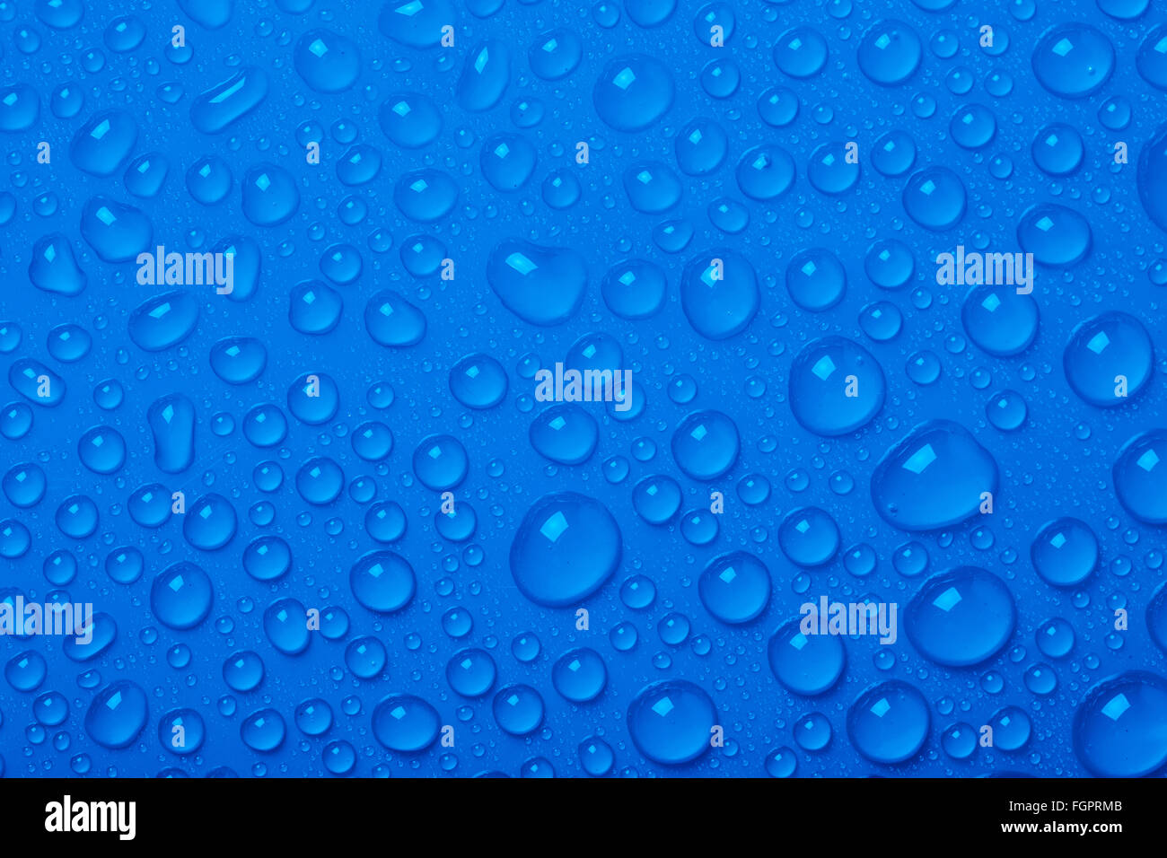 Blue water drops background Stock Photo - Alamy