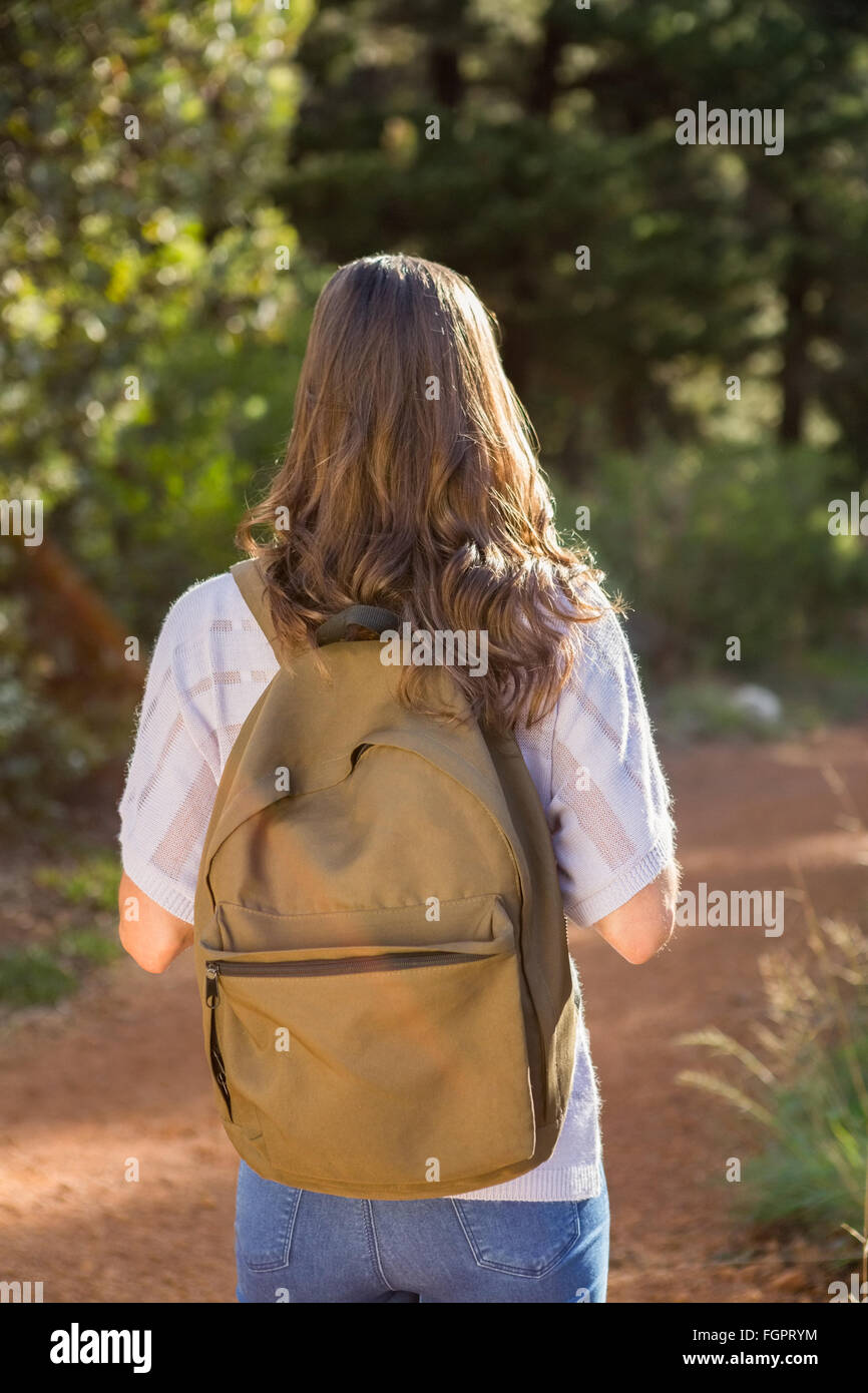 Brunette hiker hiking on path Stock Photo - Alamy