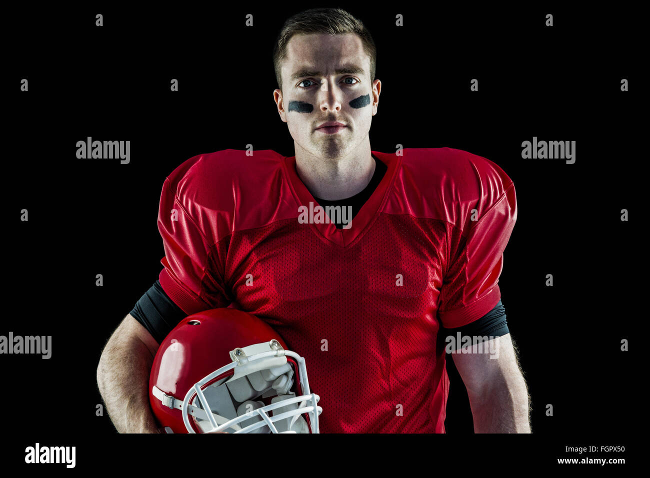 A serious american football player looking at camera Stock Photo - Alamy