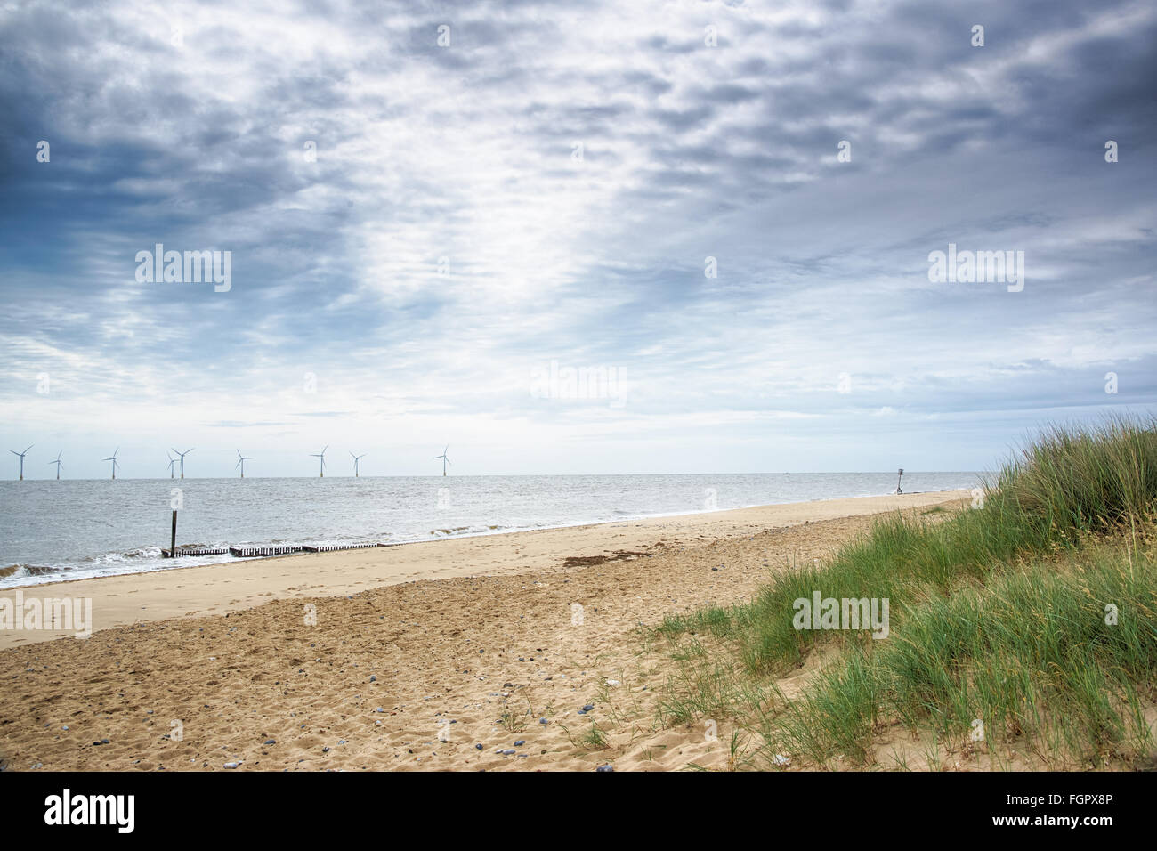 The beach, sand dunes and wind turbines at Hemsby, Norfolk, England, UK ...