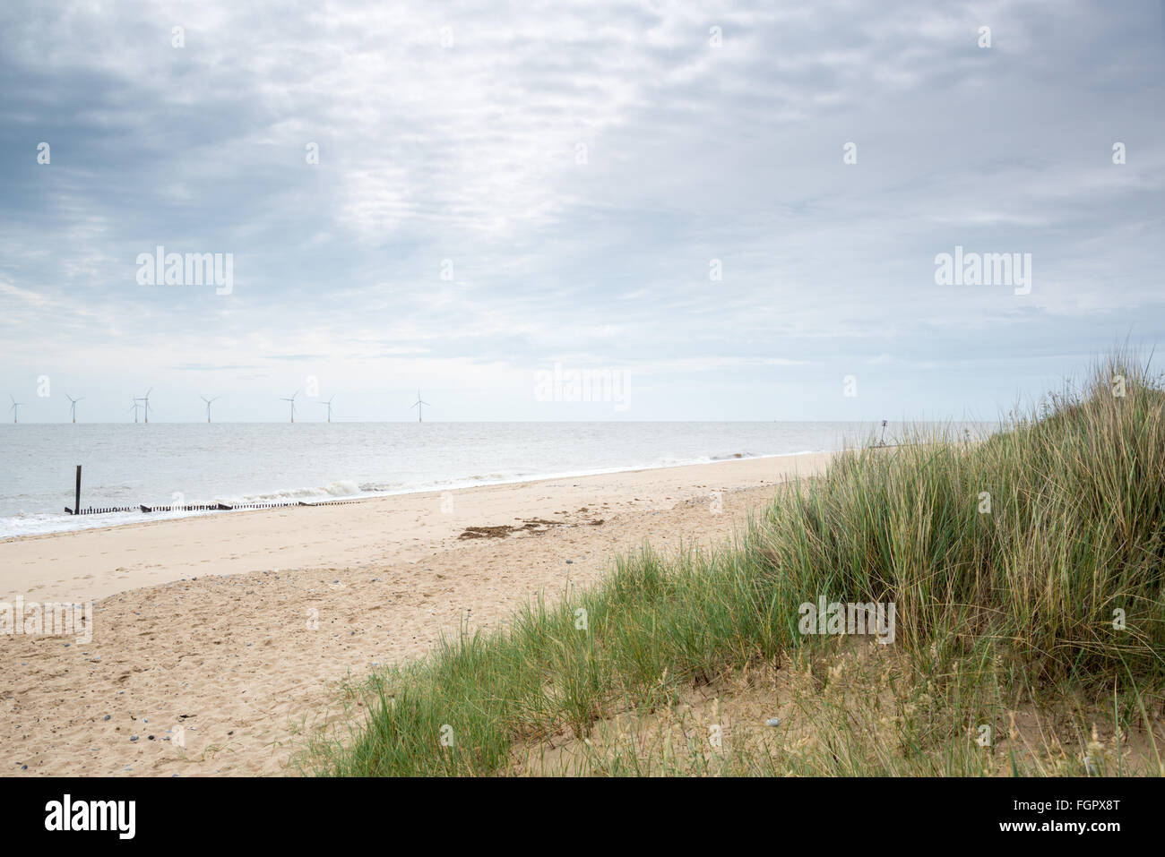 The beach, sand dunes and wind turbines at Hemsby, Norfolk, England, UK ...