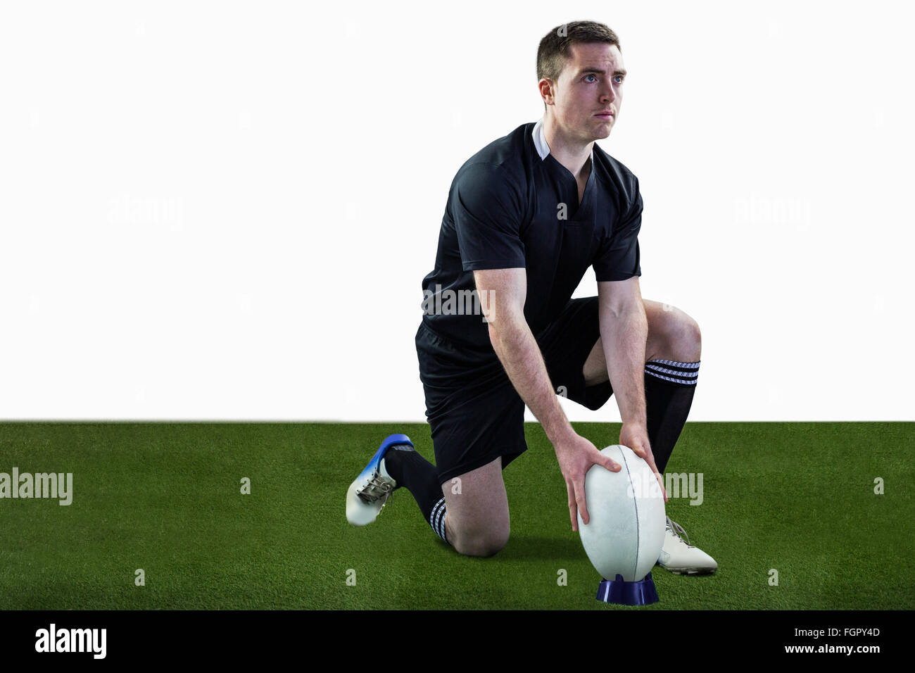 Rugby player ready to make a drop kick Stock Photo - Alamy