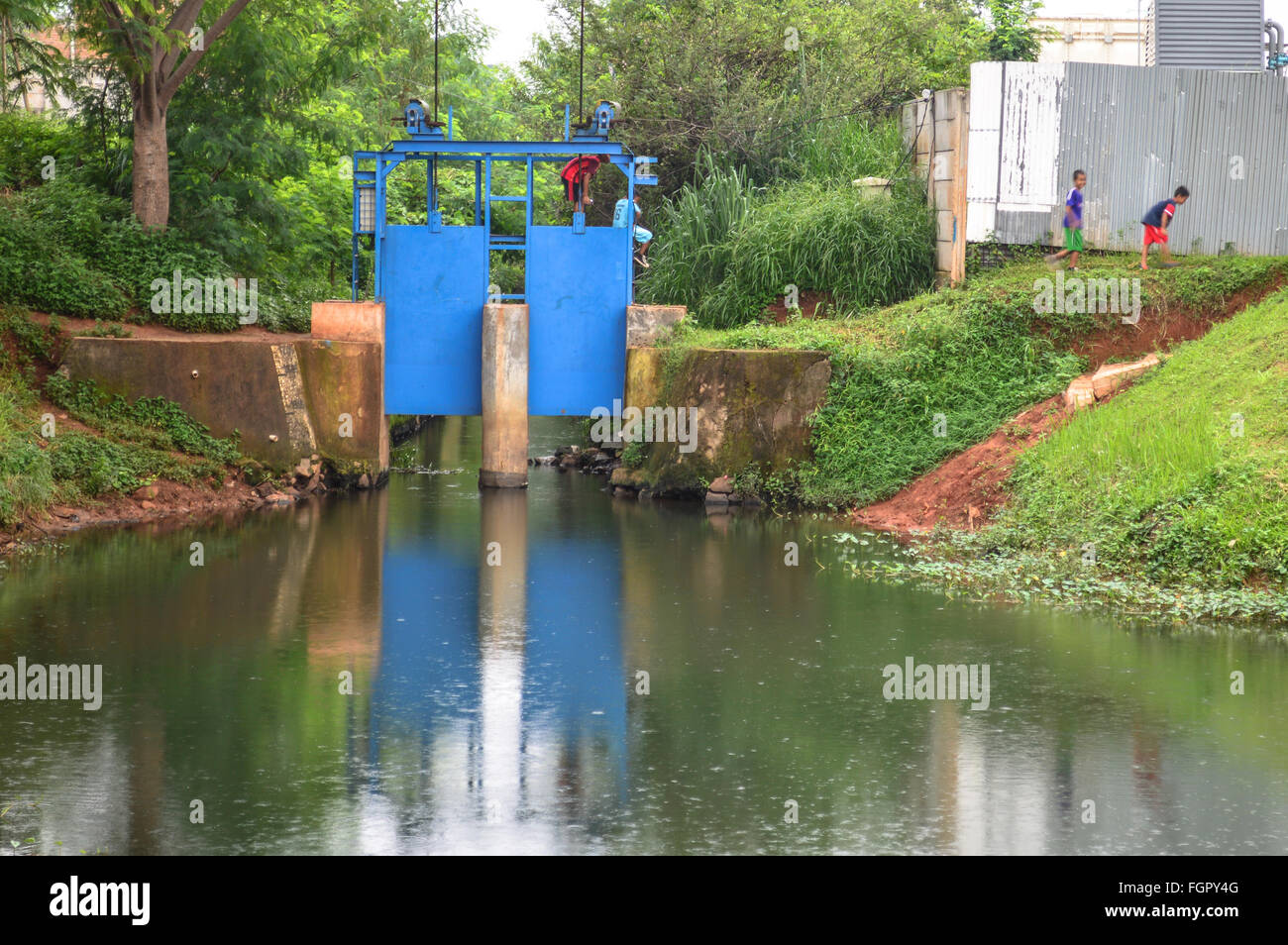 Sluice gate on Alam Sutera river in Jakarta, Indonesia Stock Photo - Alamy
