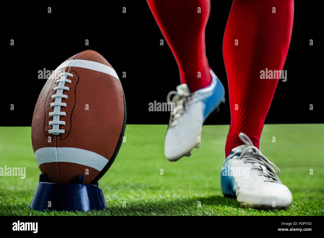 American football player being about to kick football Stock Photo - Alamy