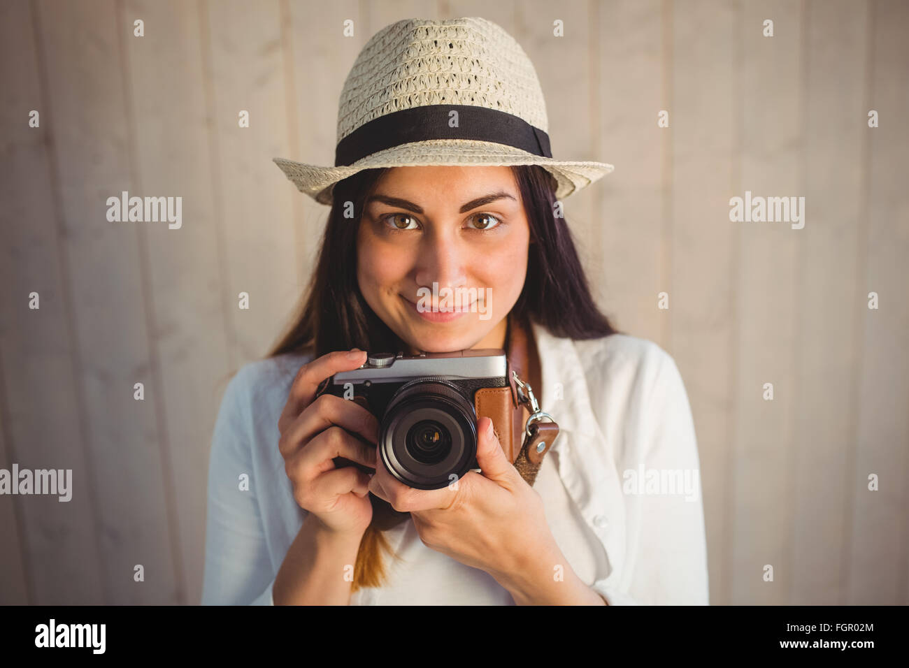 Pretty hipster using her vintage camera Stock Photo - Alamy