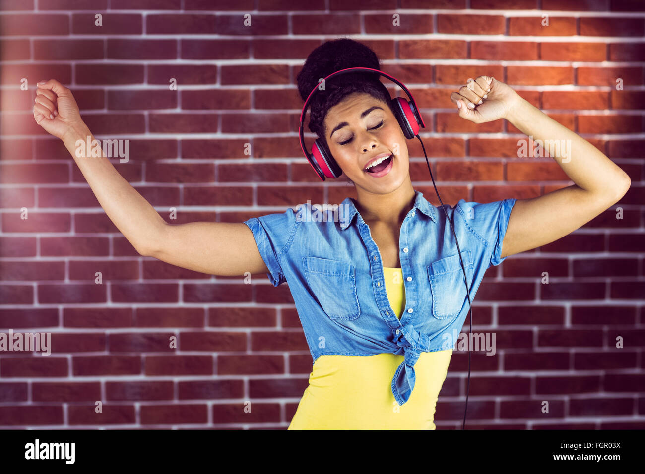 A smiling woman dancing with headphones Stock Photo - Alamy