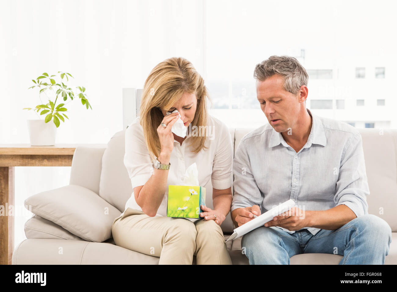 Crying female patient talking to therapist Stock Photo - Alamy