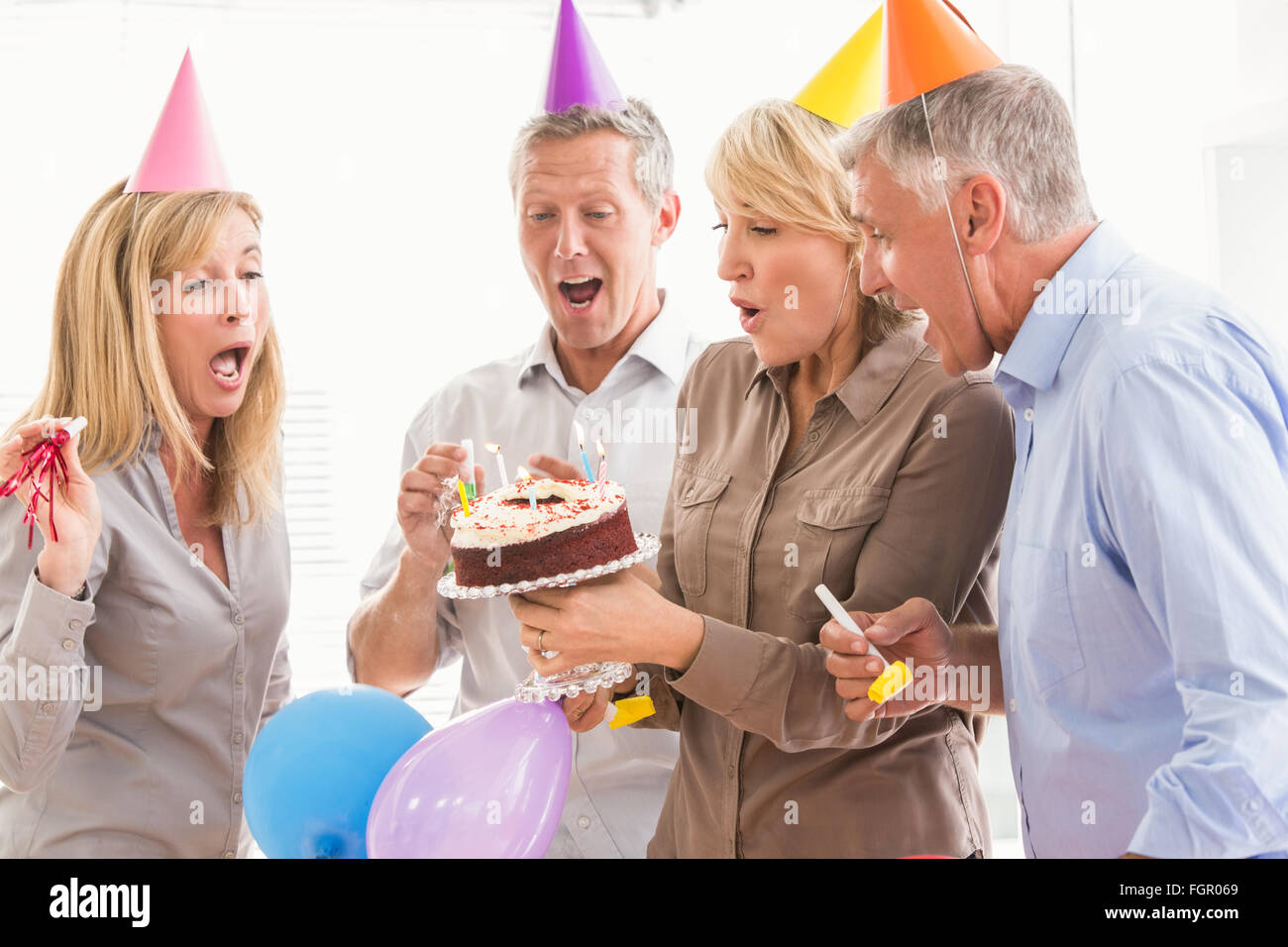 People blowing up birthday balloons hi-res stock photography and images ...