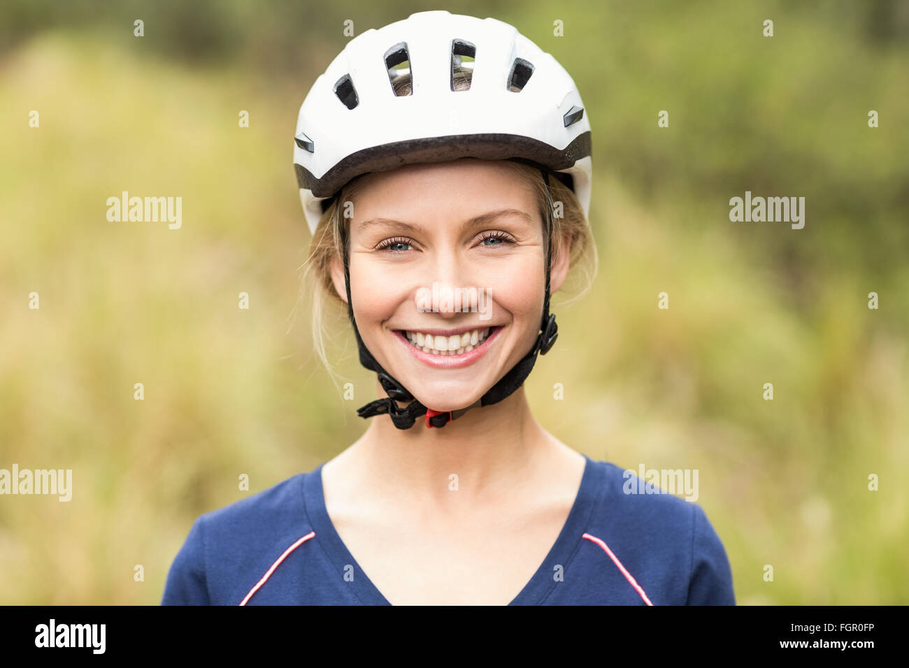 Young pretty happy biker looking at camera Stock Photo - Alamy