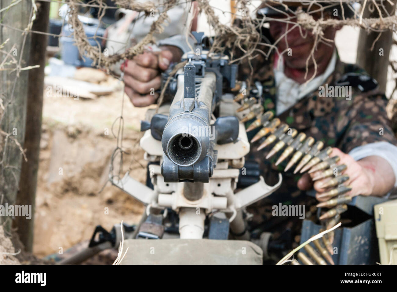 Second world war re-enactment. View along barrel of machine gun, MG42 ...