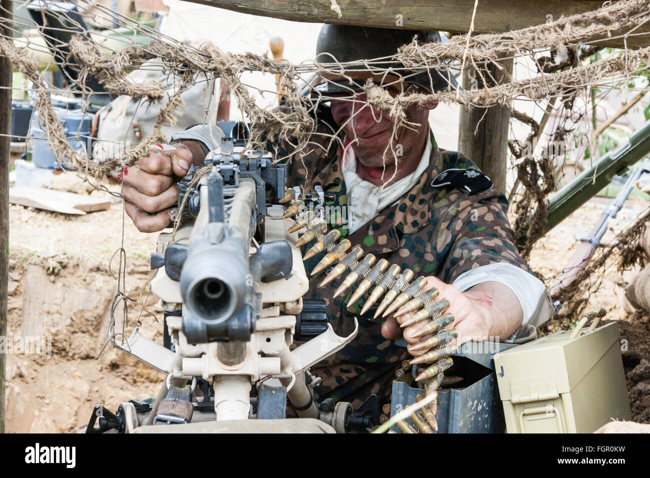 Second world war re-enactment. View along barrel of machine gun, MG42 ...