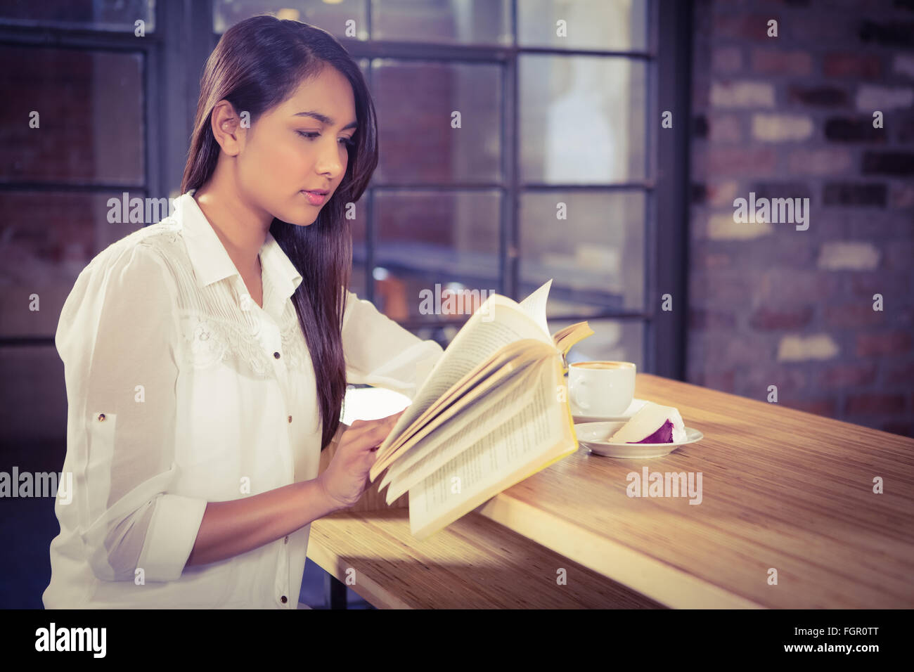 Beautiful businesswoman reading a book Stock Photo - Alamy