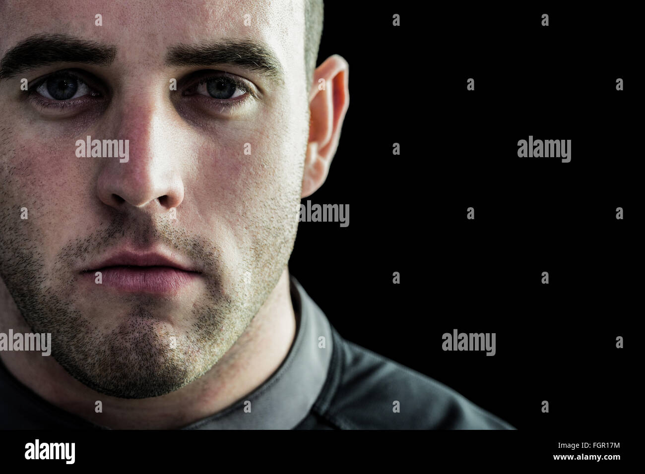 Tough rugby player looking at camera Stock Photo - Alamy