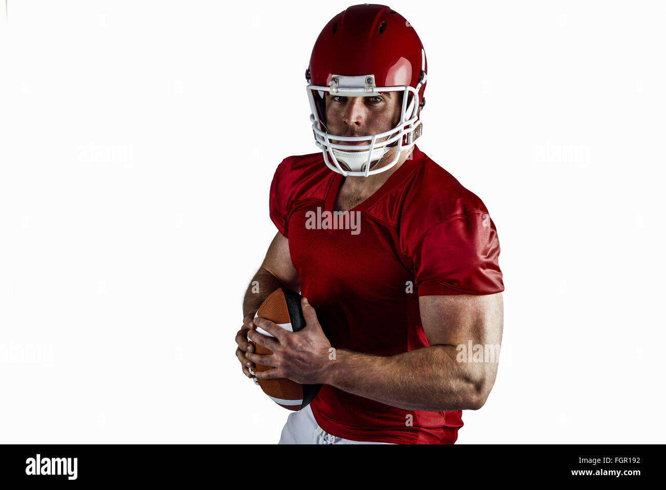 American football player holding ball Stock Photo - Alamy