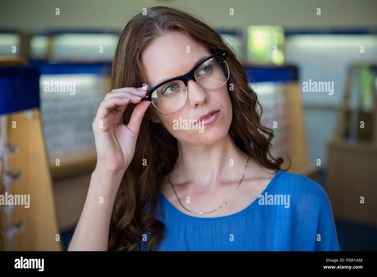 Pretty woman shopping for new glasses Stock Photo - Alamy