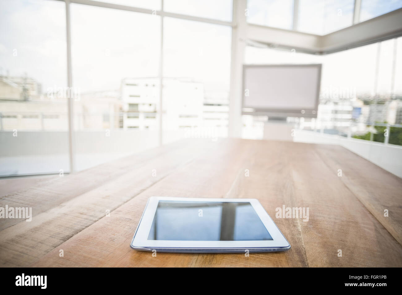 Tablet in front of meeting room Stock Photo - Alamy