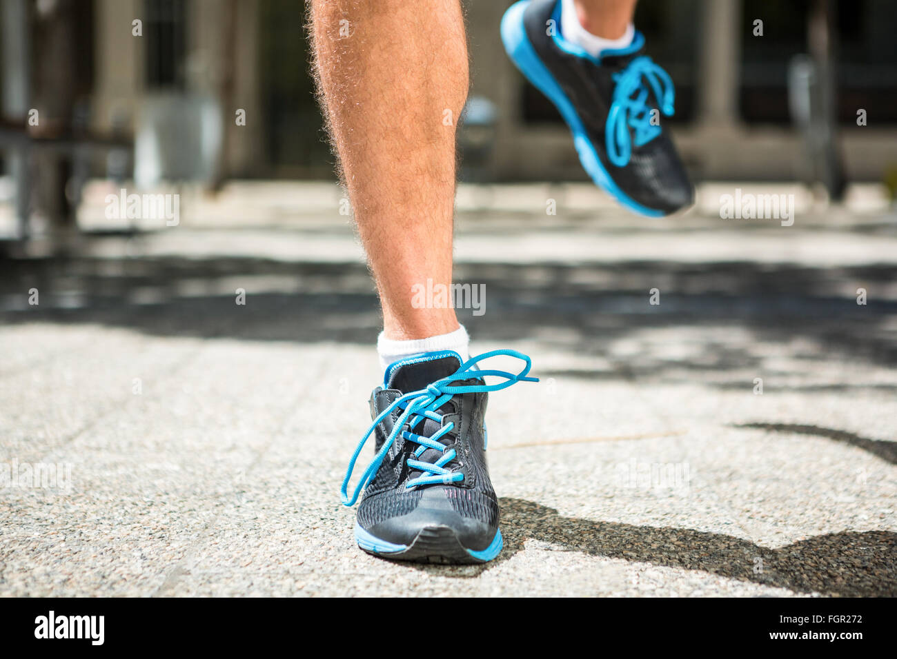 Close up view of athletes feet jogging Stock Photo - Alamy