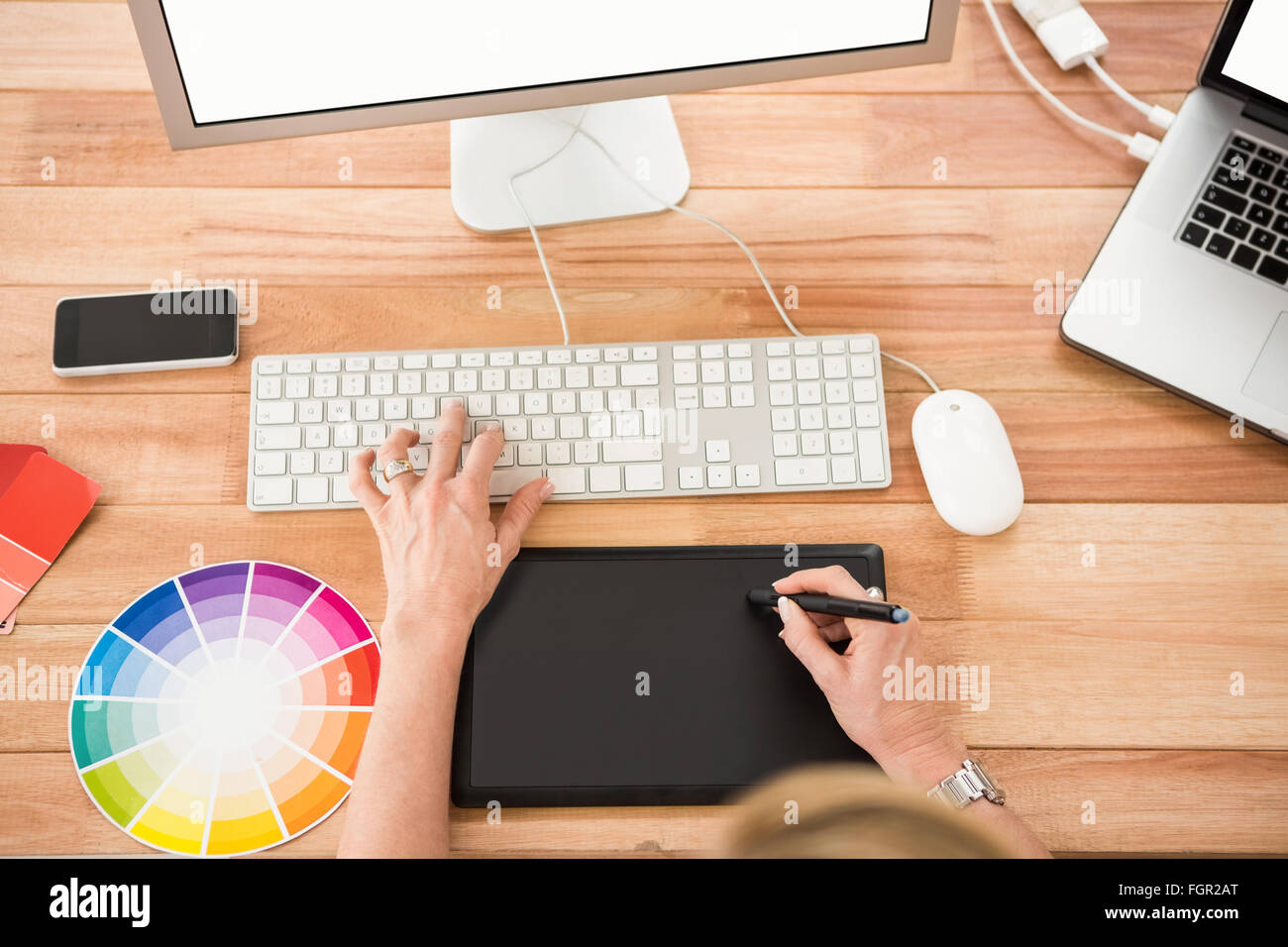 Designer working with digitizer and computer Stock Photo - Alamy