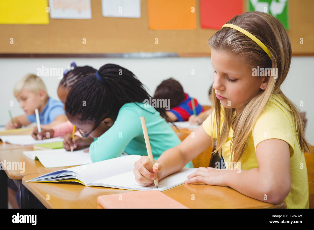 Pupils working at school work Stock Photo - Alamy