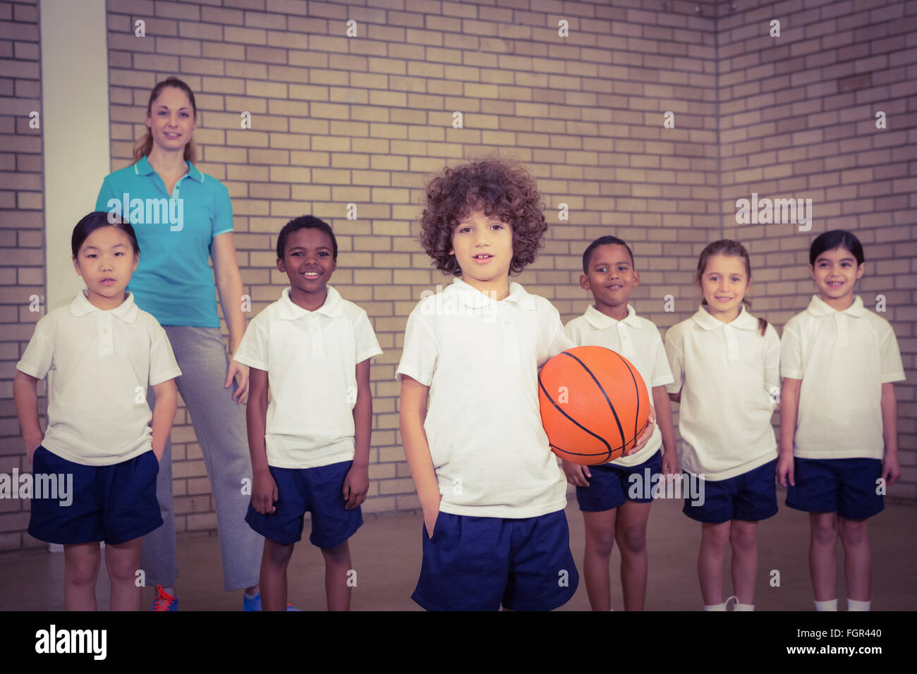 Students together about to play basketball Stock Photo - Alamy