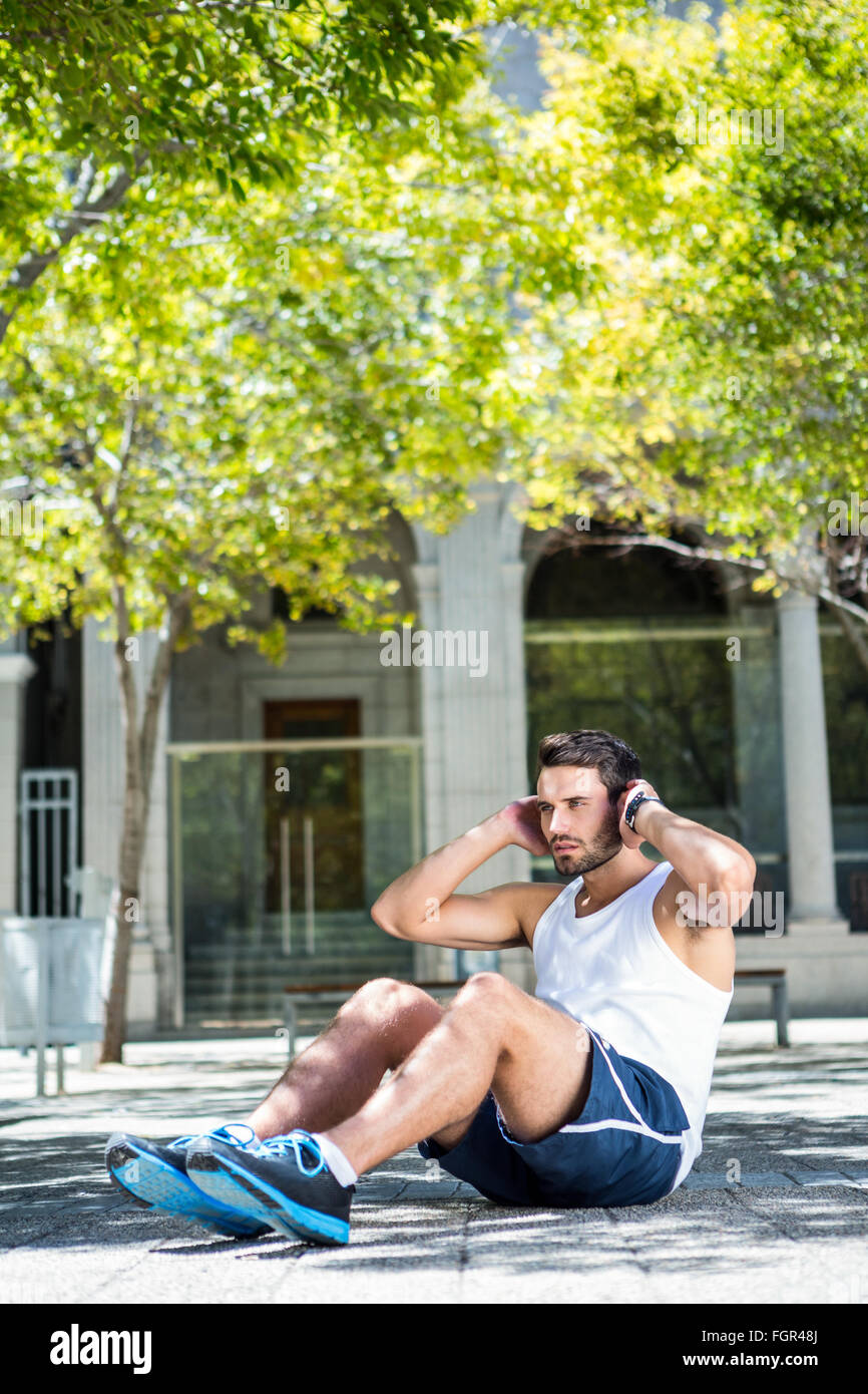 Handsome athlete doing sit ups Stock Photo - Alamy