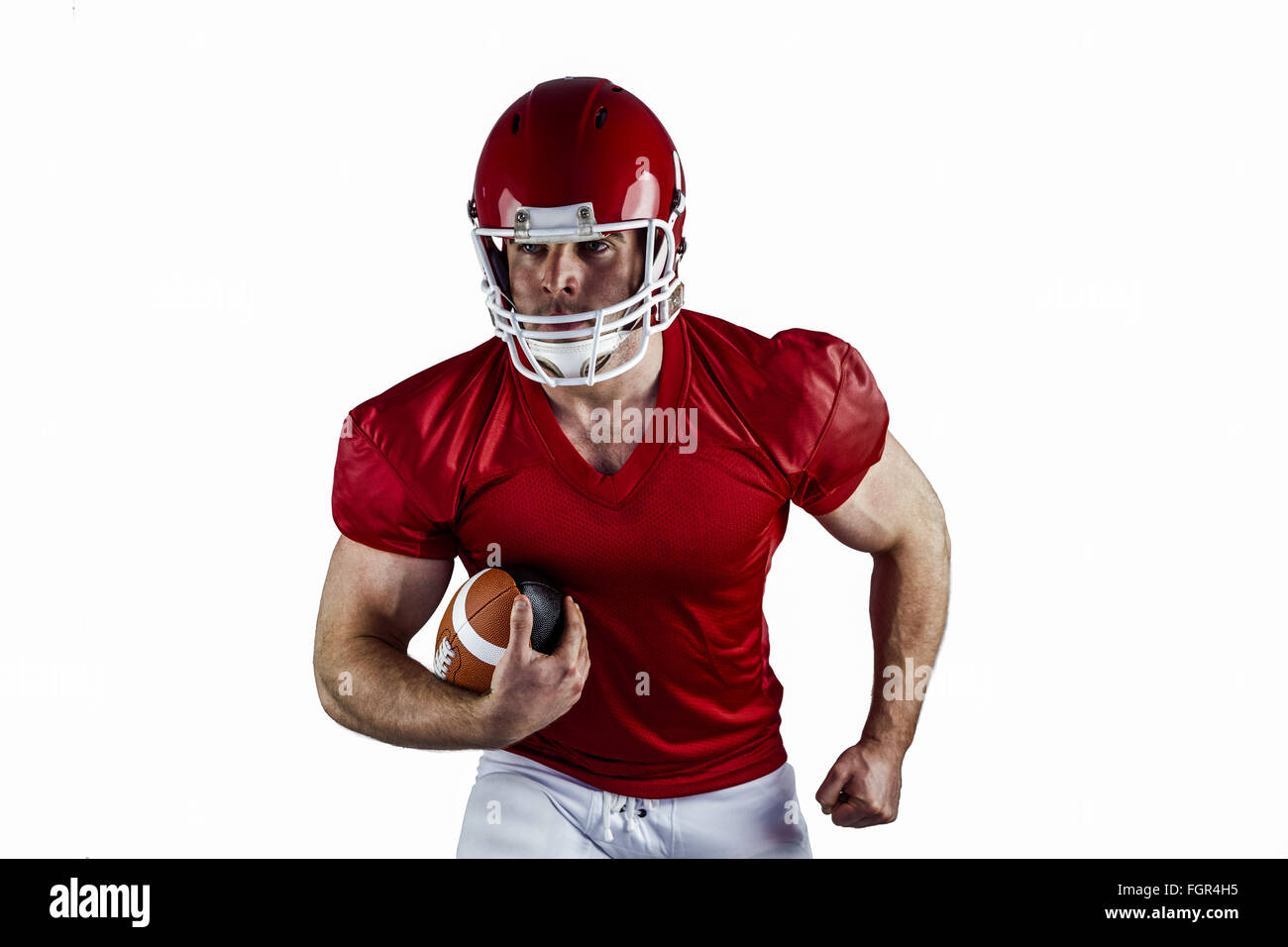 American football player holding ball Stock Photo - Alamy