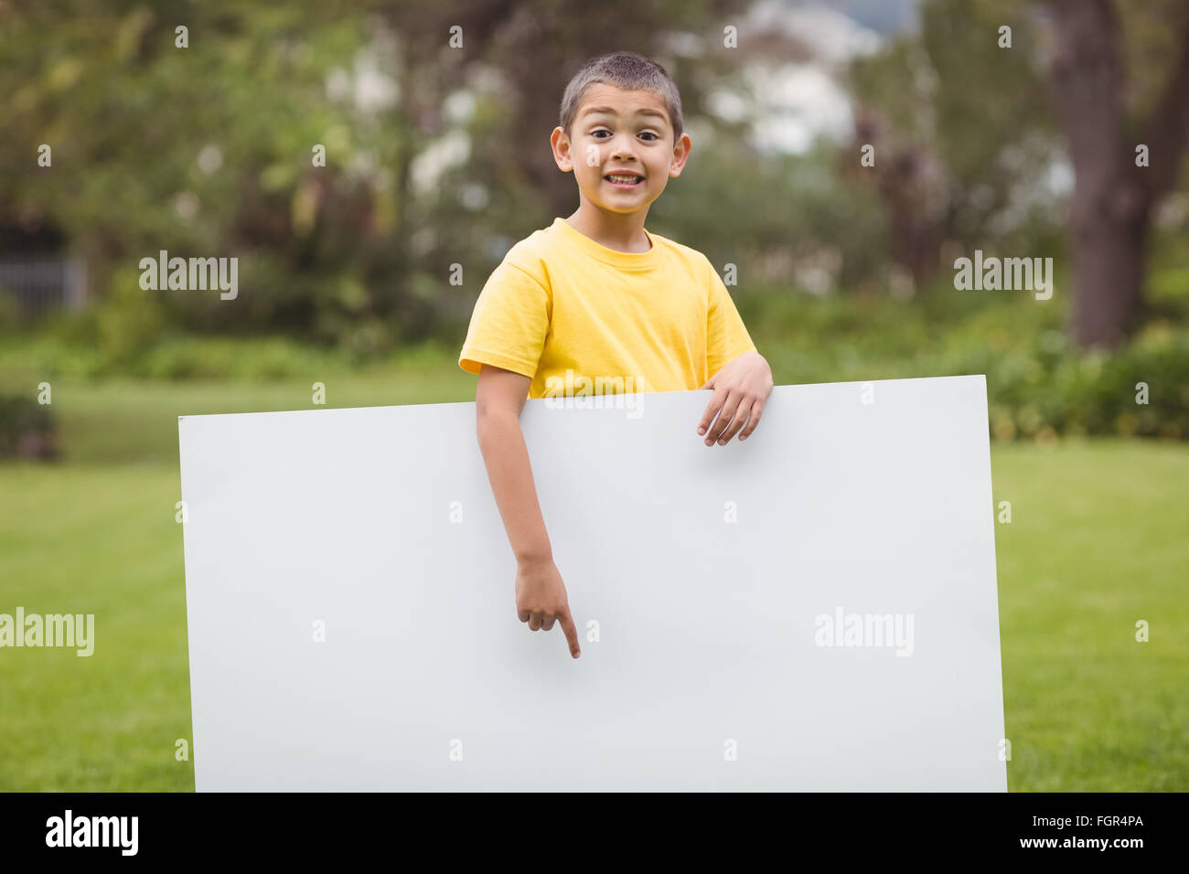 Cute pupils showing large poster Stock Photo - Alamy