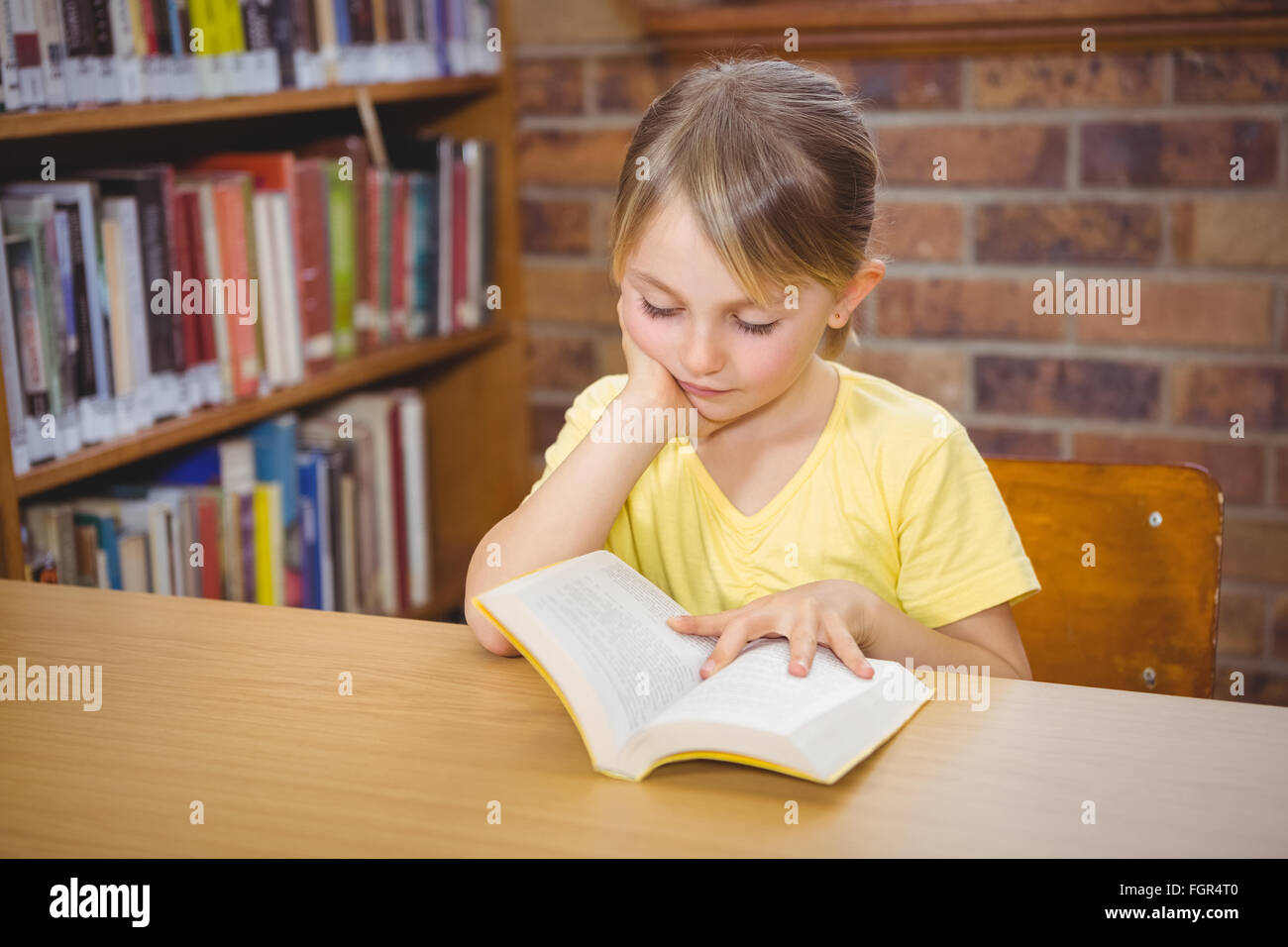 Student reading a book Stock Photo - Alamy