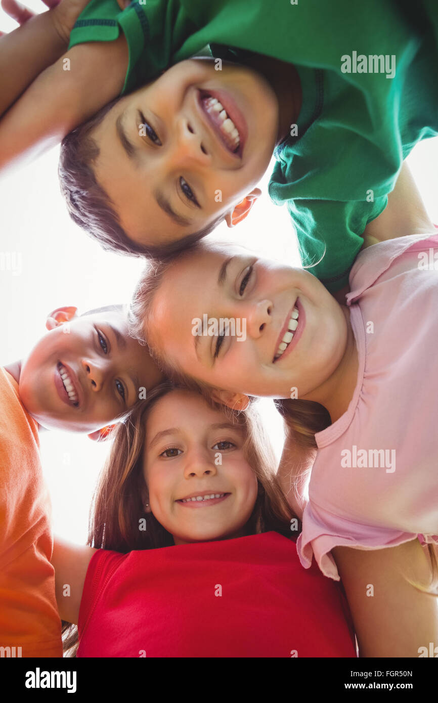 Smiling pupils looking down at the camera Stock Photo - Alamy