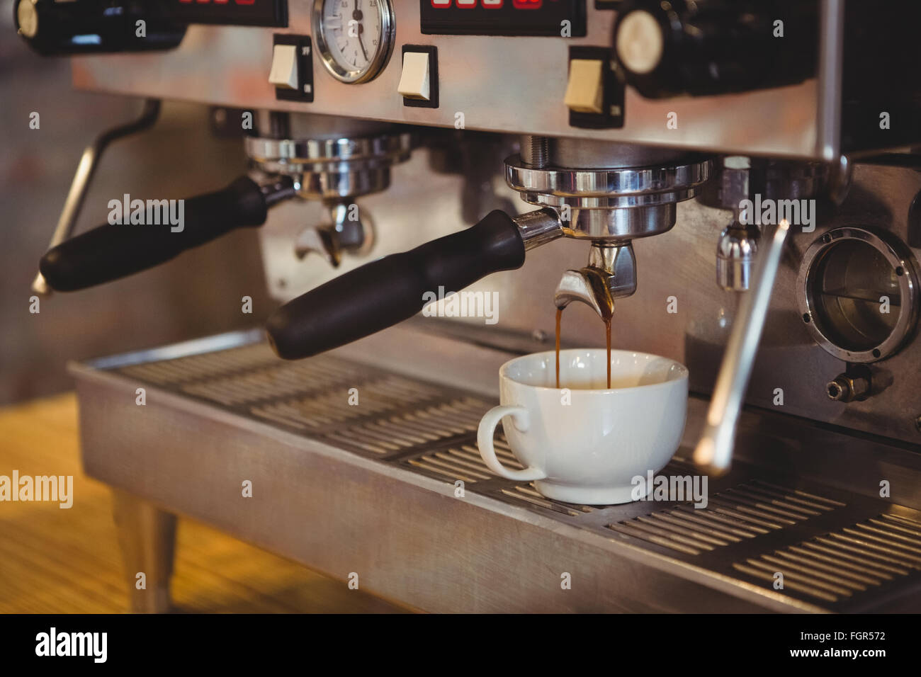Machine making a cup of coffee Stock Photo - Alamy