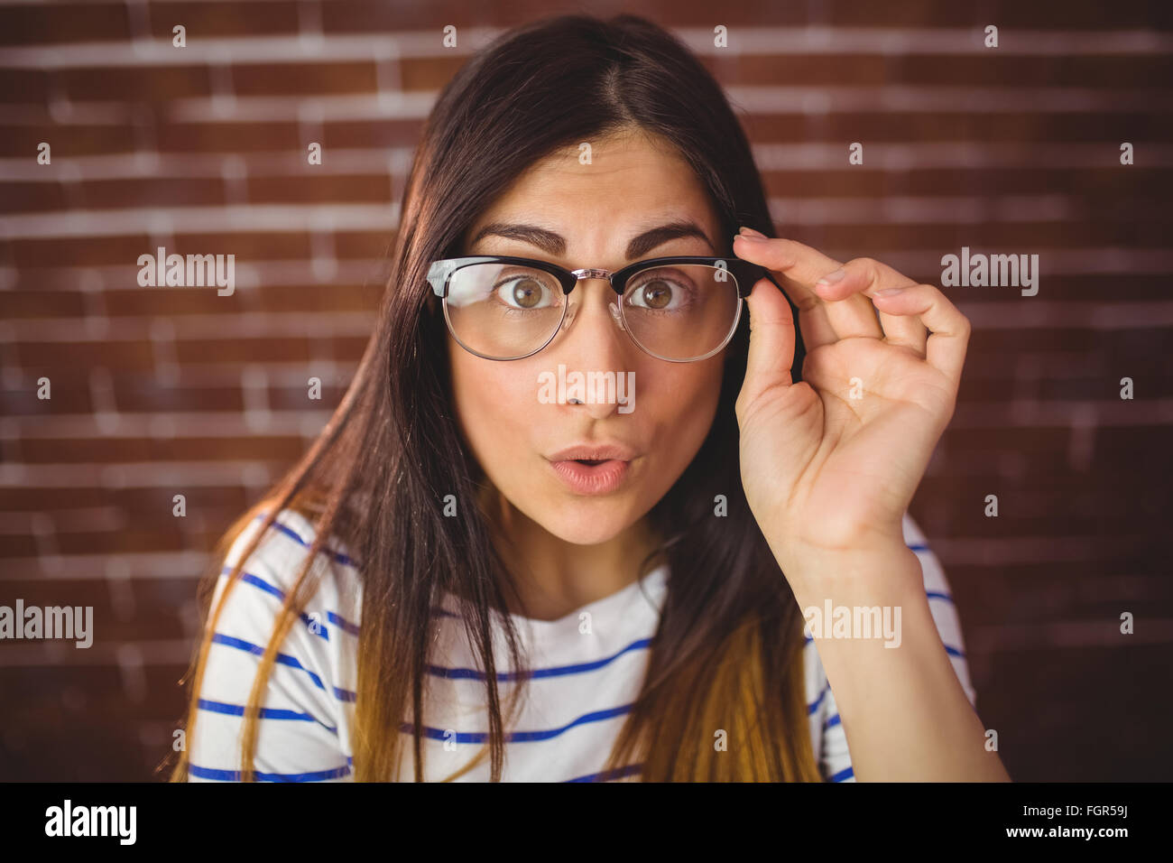 Pretty hipster posing for camera Stock Photo - Alamy