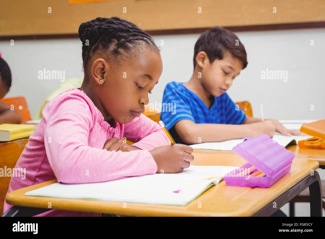 Students sitting and doing class work Stock Photo - Alamy