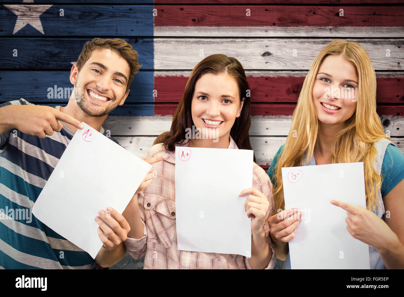Composite image of smiling students showing their exams Stock Photo - Alamy