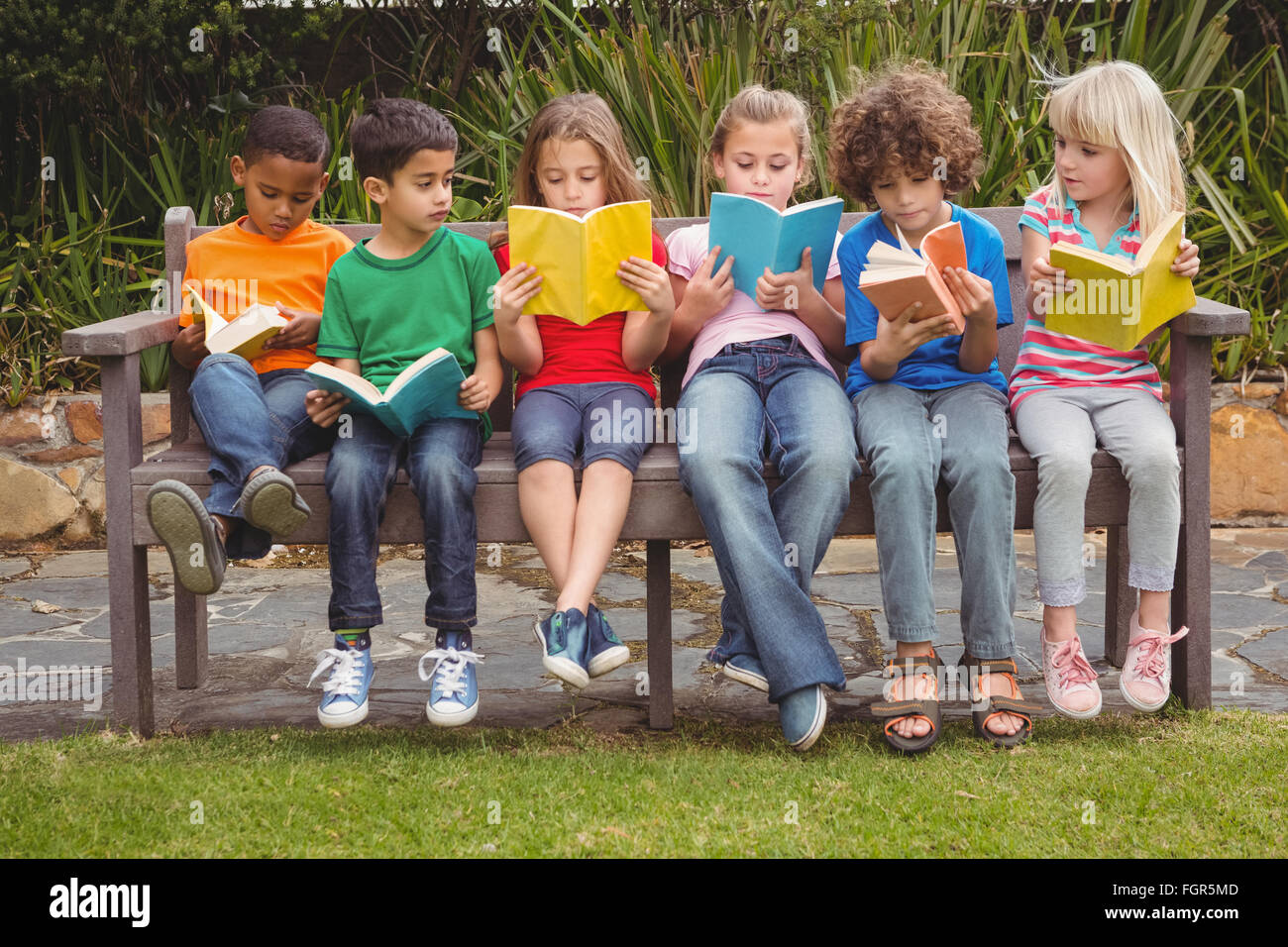 Children reading from books together Stock Photo - Alamy
